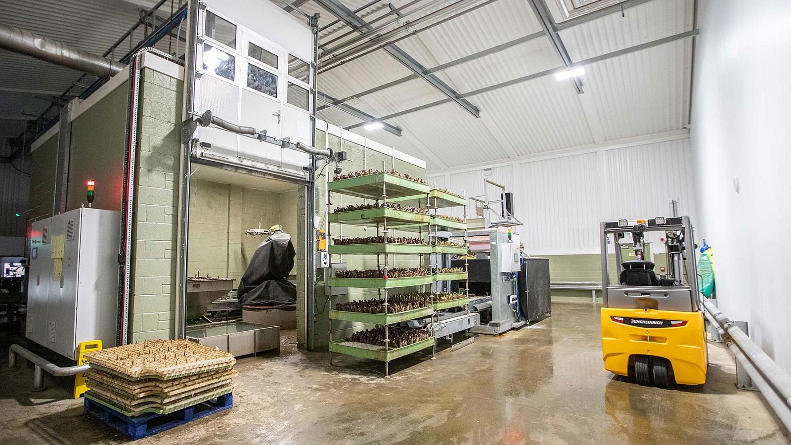 Food production facility incorporating vertical farm.